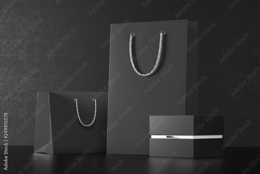 Premium black package for purchases on a black background. Black paper ...