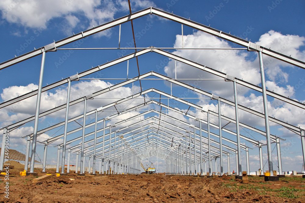 The structure of the building. Steel construction on the sky background ...