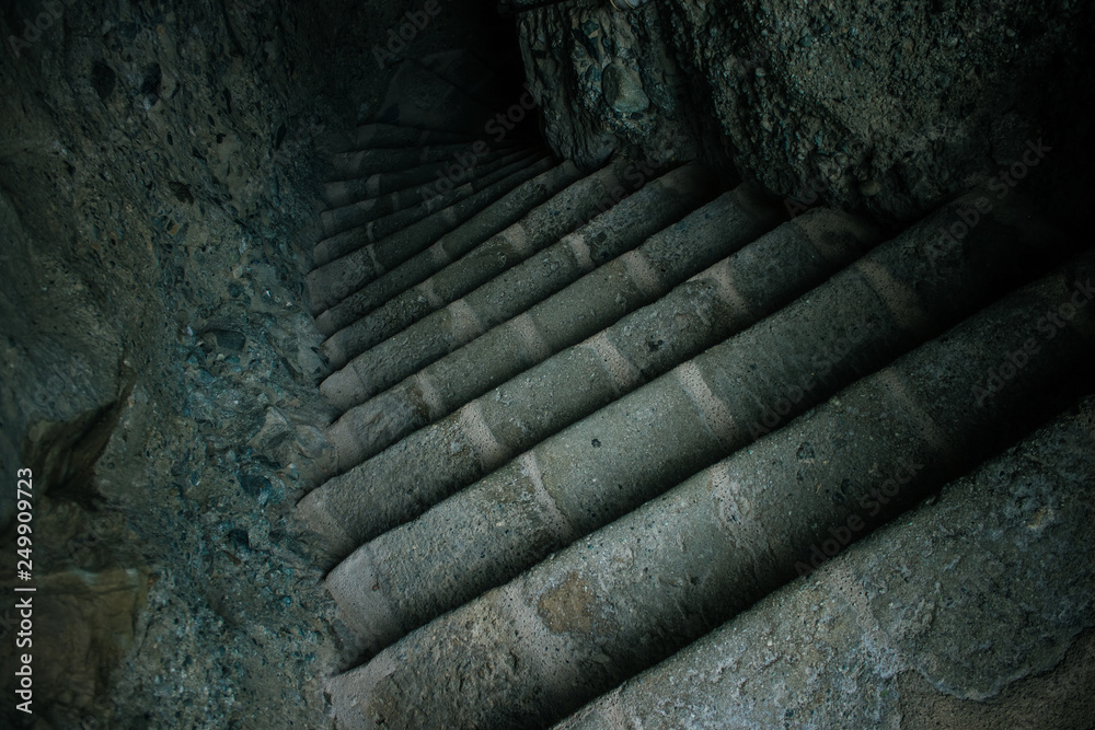 dark stairs dungeon cave path way underground in twilight lighting ...
