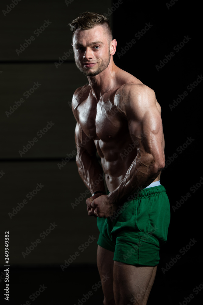 Bodybuilder Performing Side Chest Pose Stock Photo | Adobe Stock