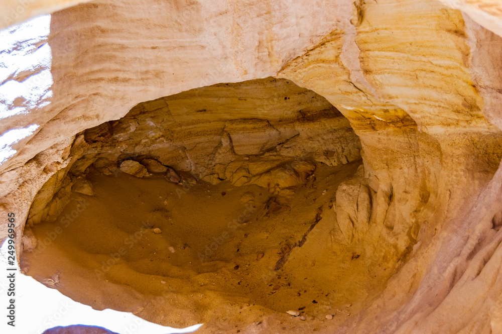 Round shape of deep cave in the rock of ancient cooper mines canyons ...