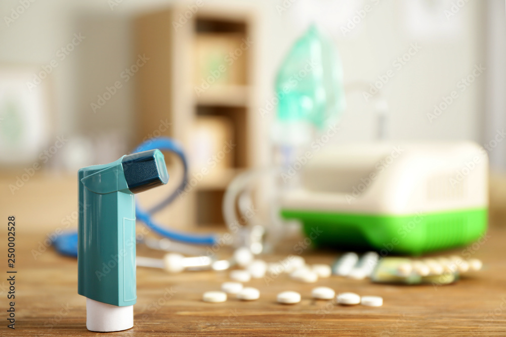 Inhalers with pills on table at home Stock Photo | Adobe Stock
