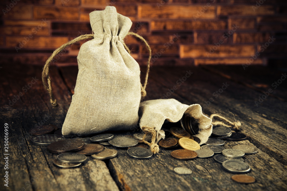 Pouch with old money and coins. Vintage style.Treasure searching ...