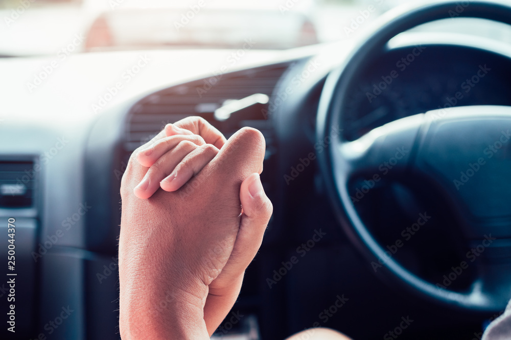Father's hand holds the daughter's hand while driving.Concept of dad ...