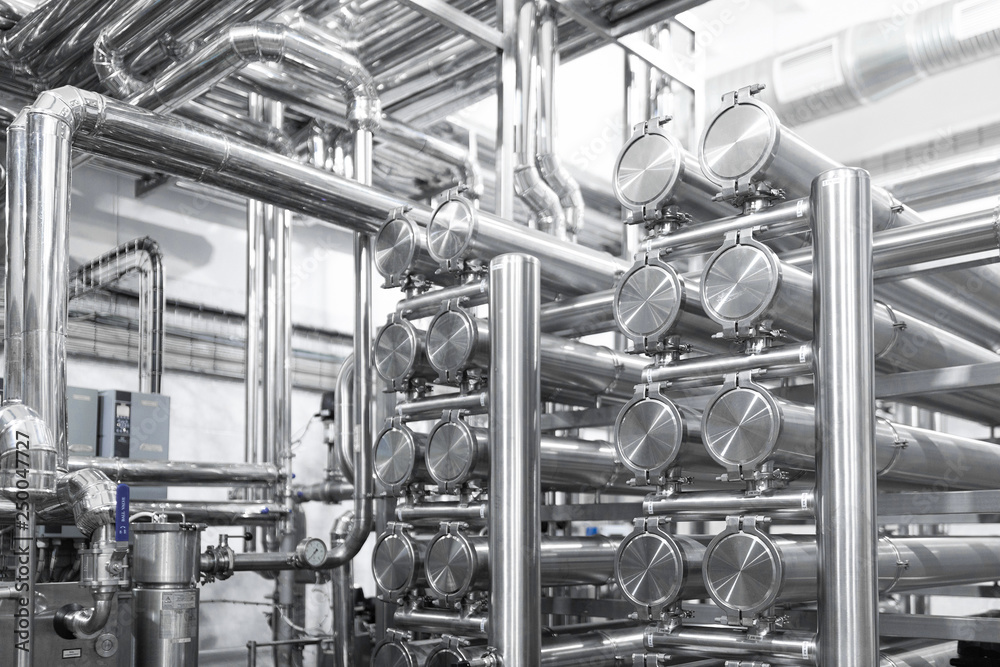 Steel water pipeline, chrome pipes, pipe lines in plant workshop ...