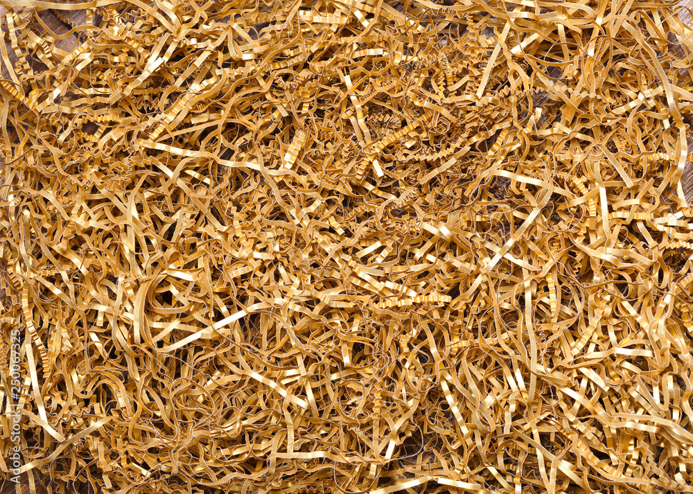 olden shredded paper for gifting, shipping and stuffing. Top view ...