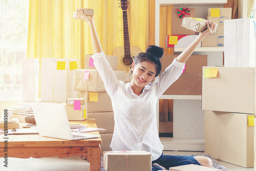 Asian smiling young women throw box product after order from customer ...