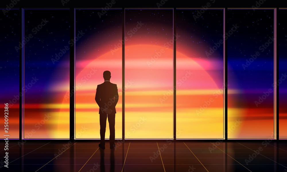 Businessman standing by the window looking out. Man looks into ...