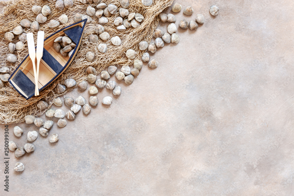 Fresh raw Surf clam chamelea gallina, fishing boat with oars and ...