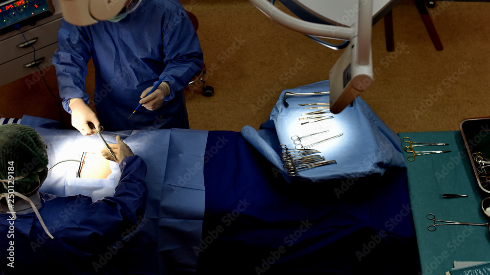 Medical Team Performing Surgical Operation in Modern Operating Room ...