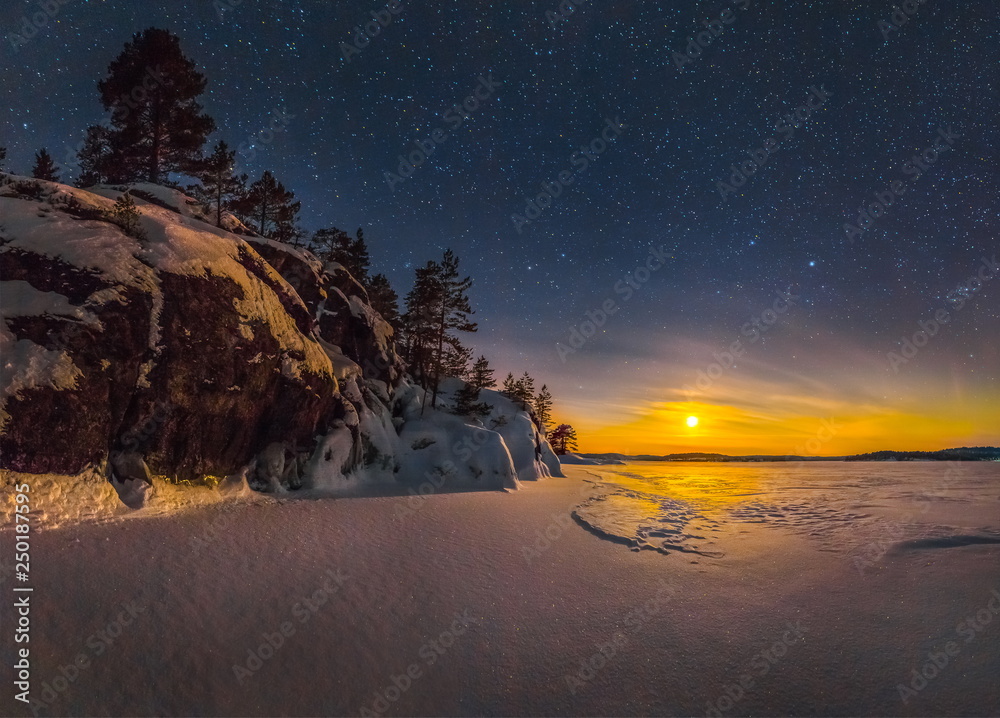 Northern lights on Lake Ladoga in the Republic of Karelia. Full moon ...