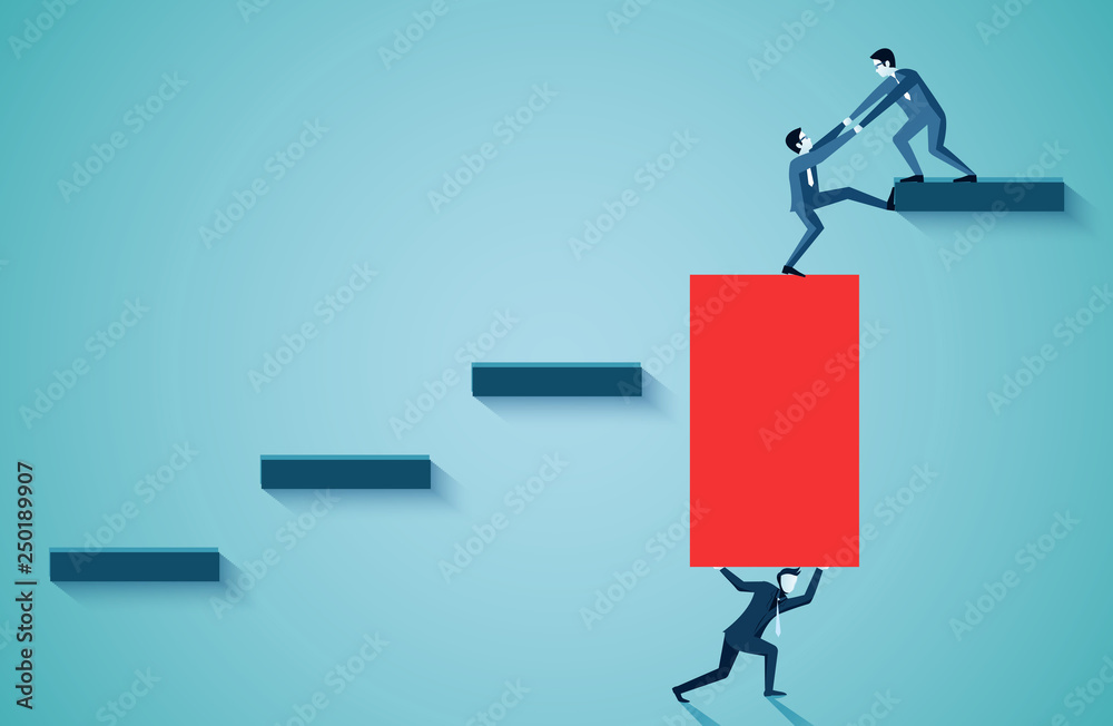 Business teamwork concept. one businessman is helping to pull one more ...