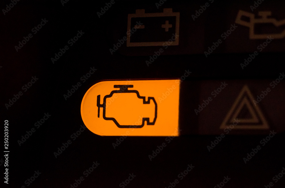 Warning sign of a car engine, orange engine sign on a panel of car ...
