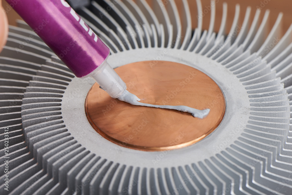 applying thermal paste to heat sink Stock Photo | Adobe Stock