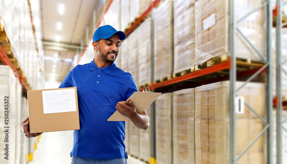 logistic business and shipment concept - happy indian delivery man or ...