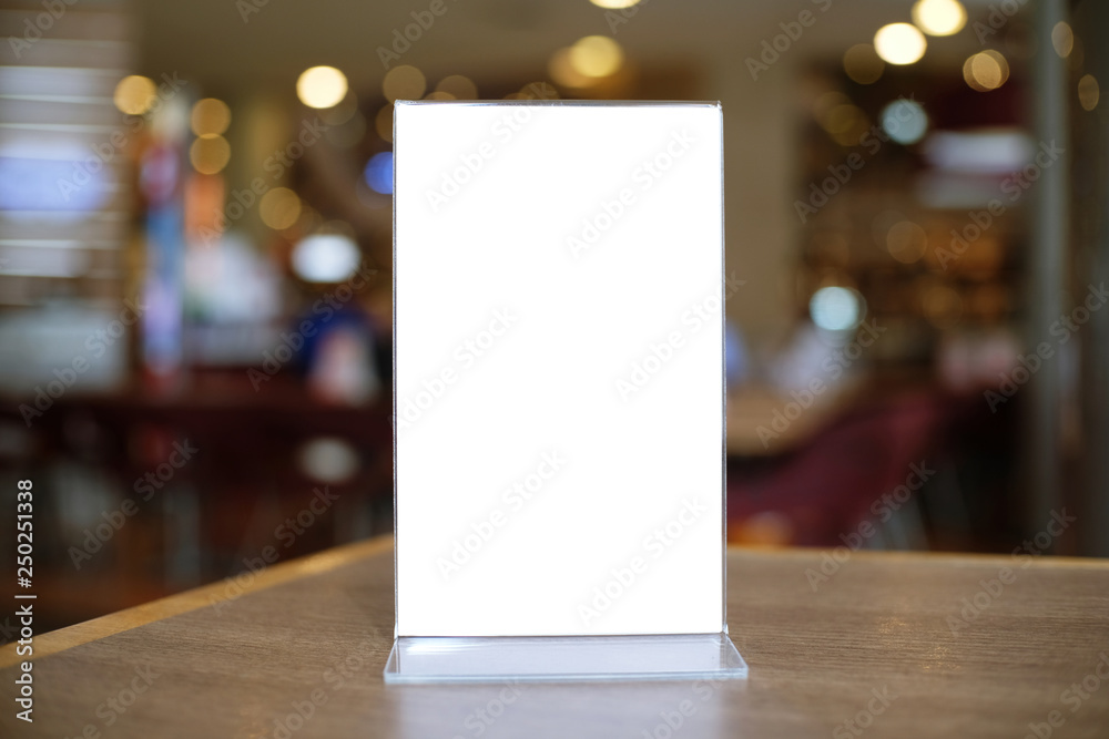 Menu frame standing on wood table in Bar restaurant cafe. space for ...