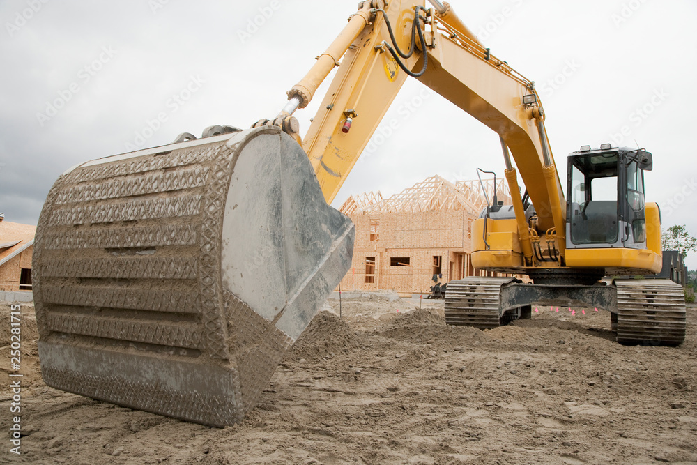 Bulldozer breaking ground at construction site Stock Photo | Adobe Stock