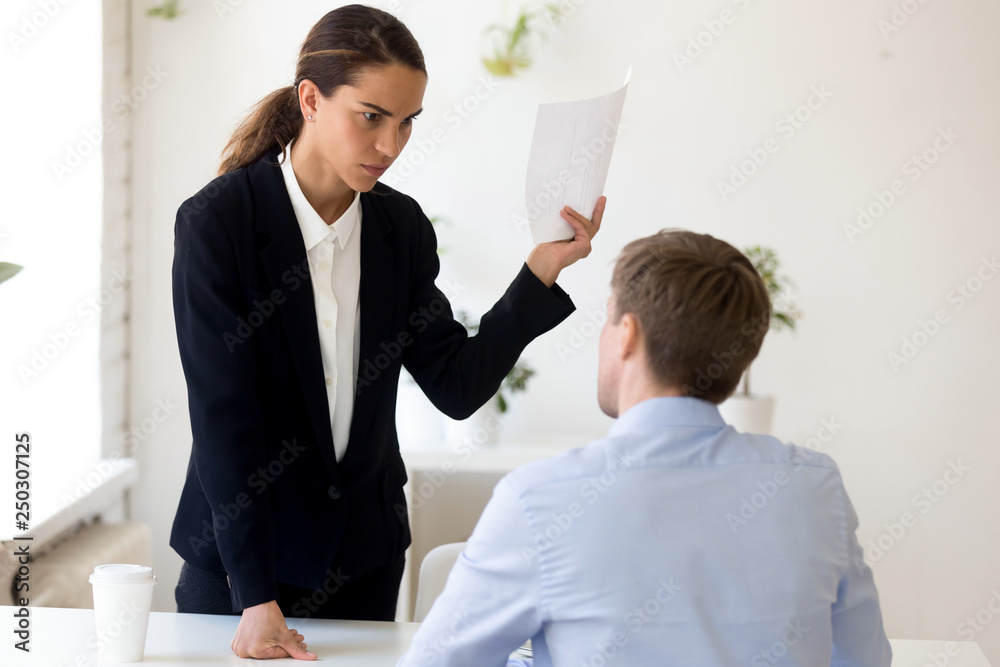 Angry boss scolding unqualified employee telling about mistake in ...