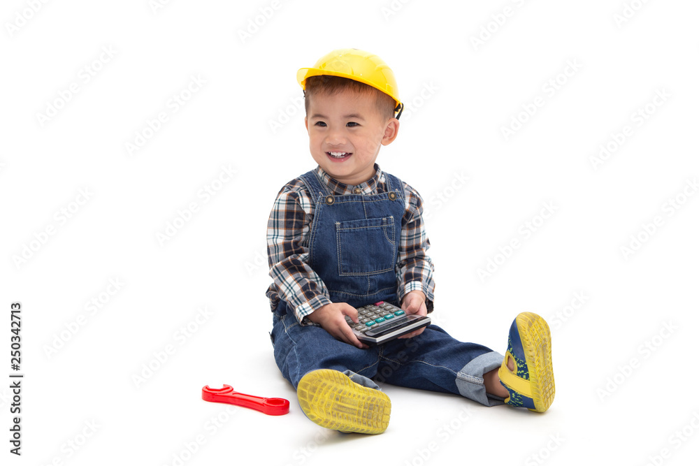 Asian Thai baby boy wearing an engineer suit with hard hat and holding ...