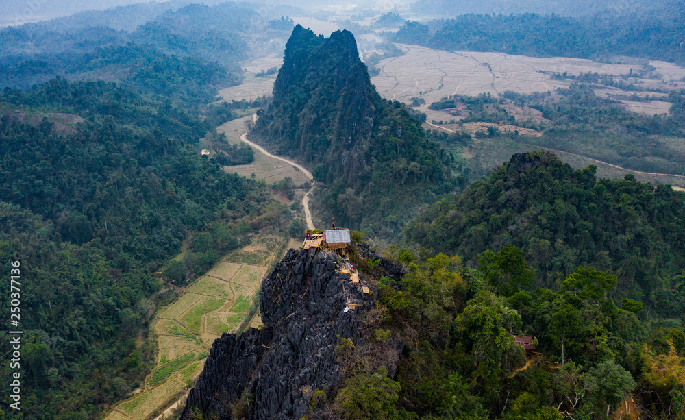 (View from above) Stunning aerial view of a beautiful little hut on top ...