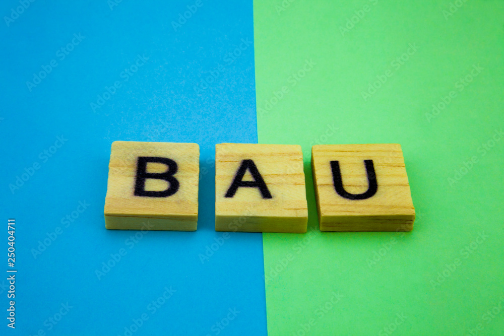 Word BAU on the green and blue background. Business As Usual concept ...