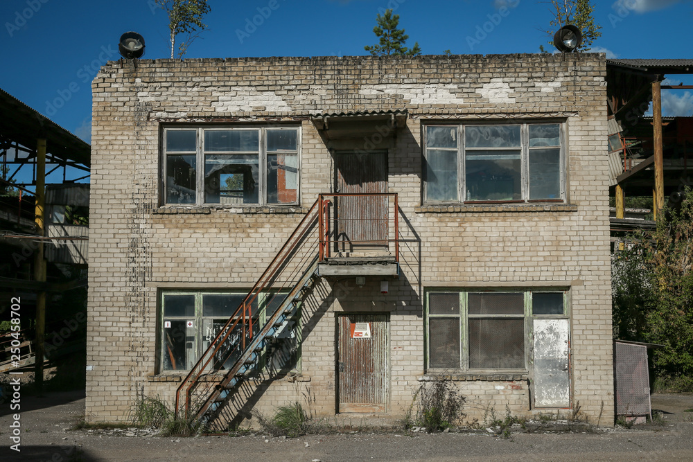 Old soviet Industrial building in an old abandoned sand quarry. Image ...