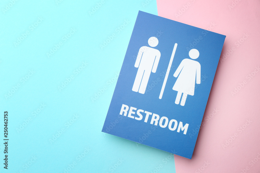 Unisex restroom sign board on color background. Concept of transgender ...