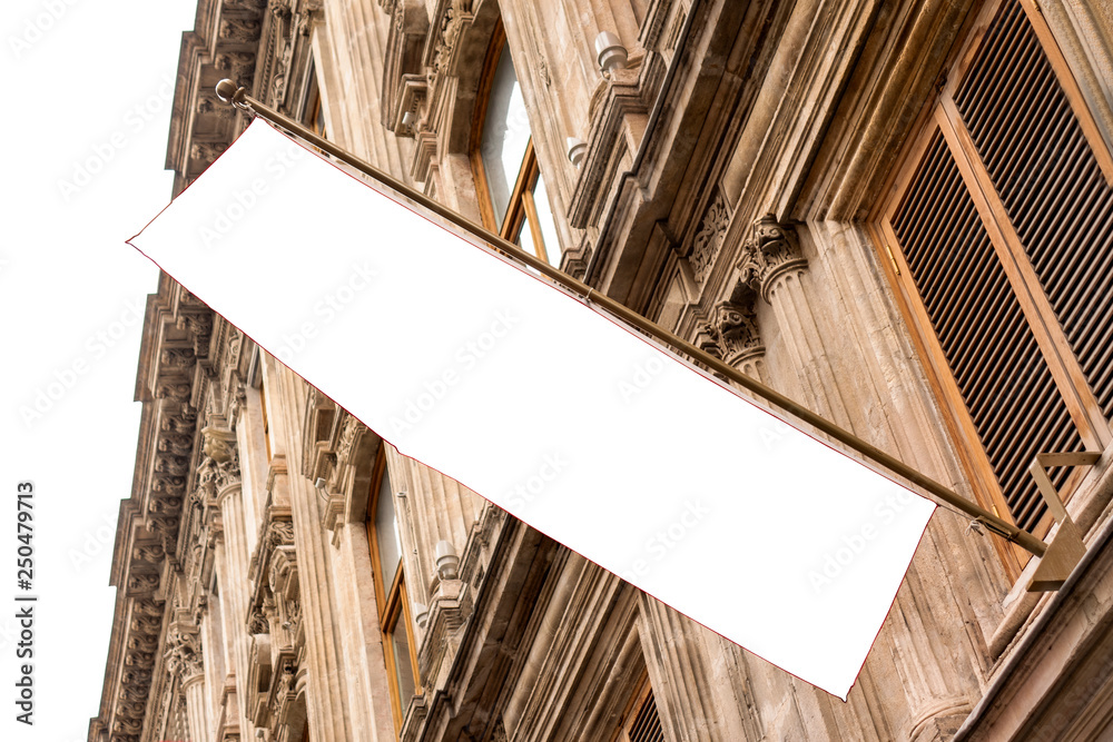 Blank white vertical banner on old building facade, design mockup ...