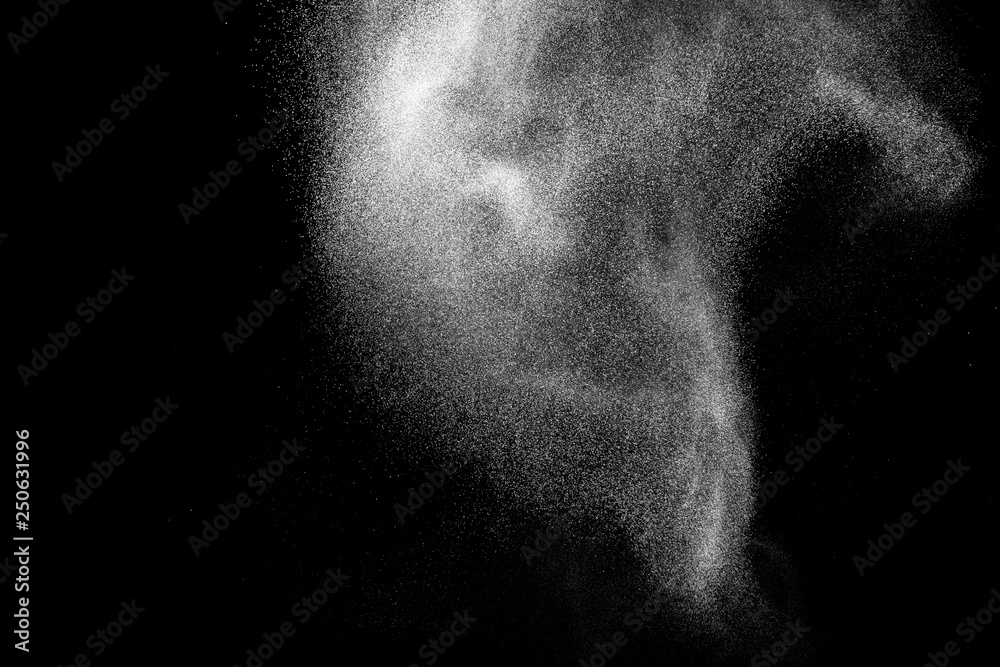 Bizarre forms of white powder explosion cloud against black background ...