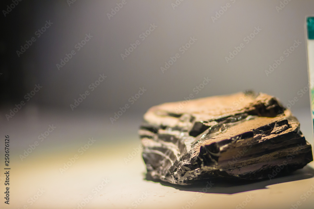 Obsidian stone specimen for education. Obsidian is a naturally ...