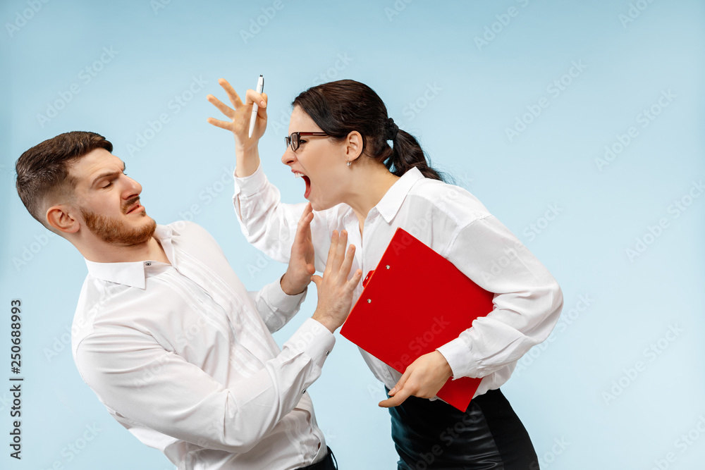 Angry boss. Woman and his secretary standing at office or studio ...