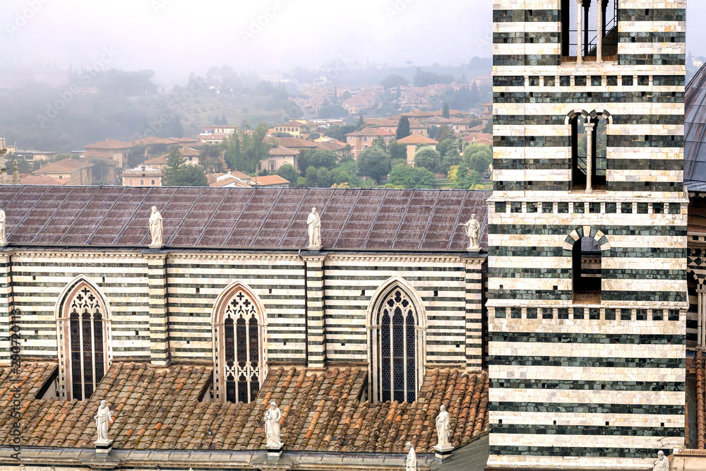 City with historical buildings and roofs of the 14th century Duomo di ...