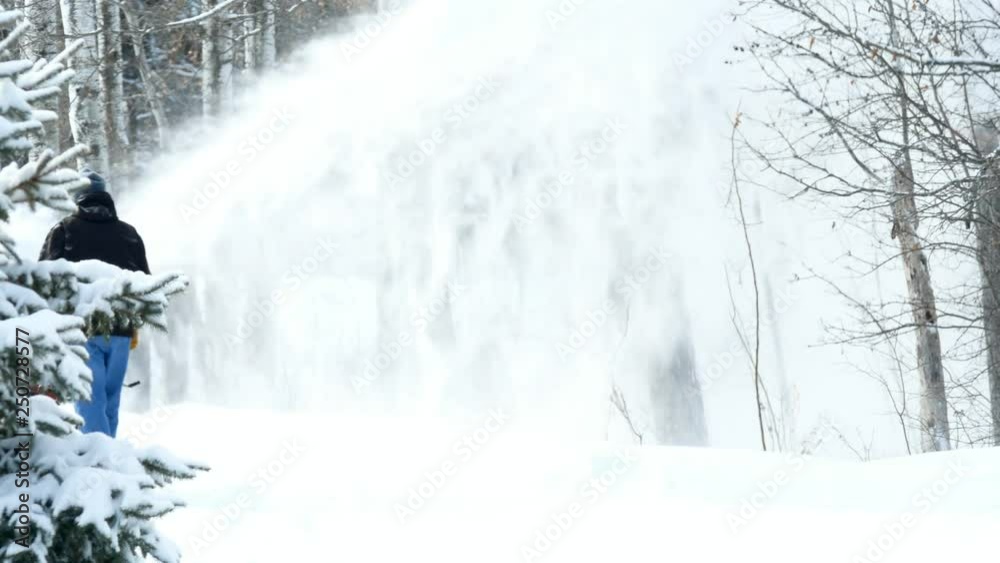 Snow flies from a snow blower after a blizzard storm. vídeo do Stock ...