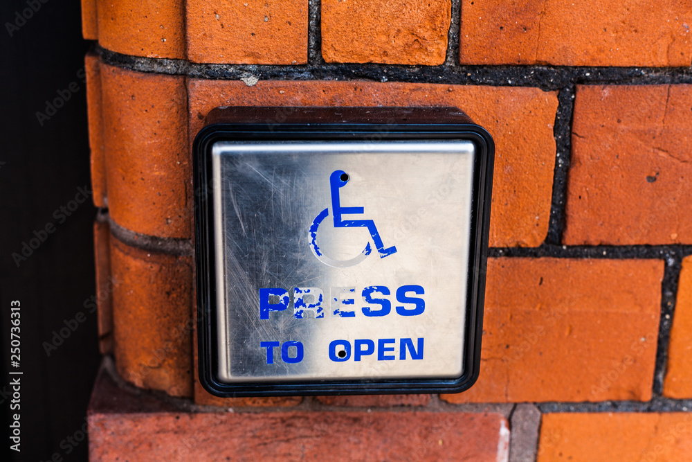 Assistance button for disabled people on the building entrance ...