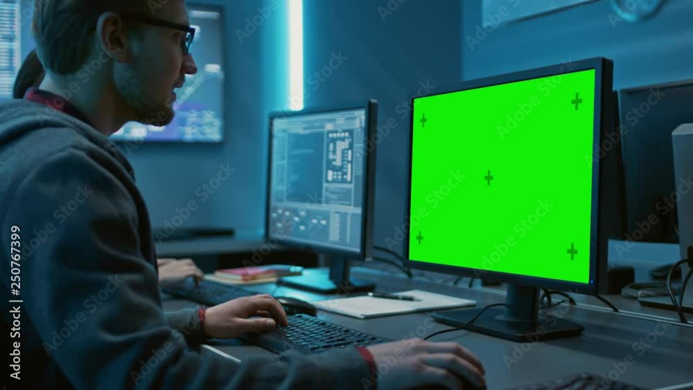 IT Programer Working on Desktop Green Mock-up Screen Computer in Data ...