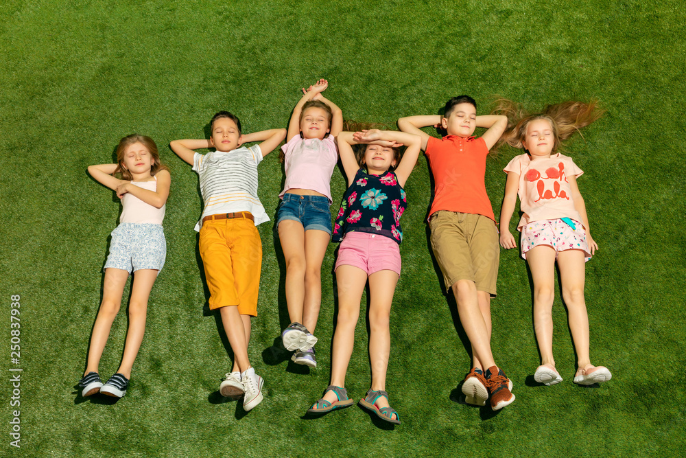 Group of happy children playing outdoors. Kids having fun in spring ...