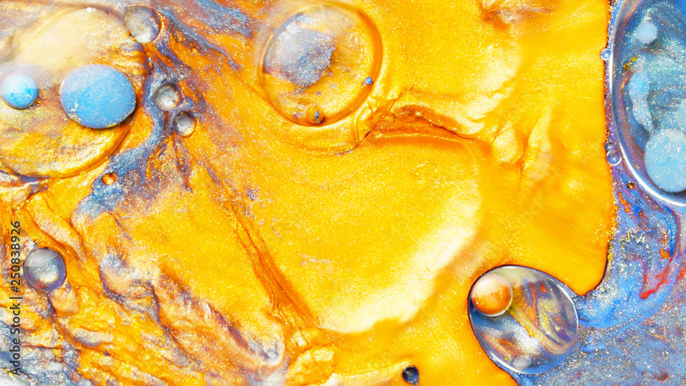 Colorful sparkling paints mix in beautiful patterns. Oil ink of yellow ...