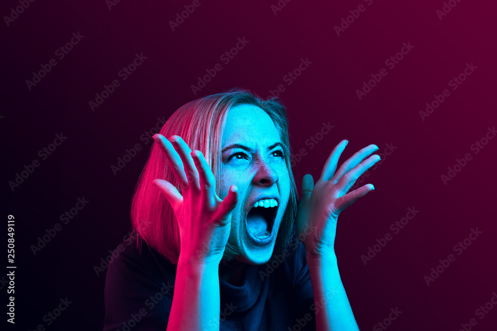 Screaming, hate, rage. Crying emotional angry woman screaming on neon ...