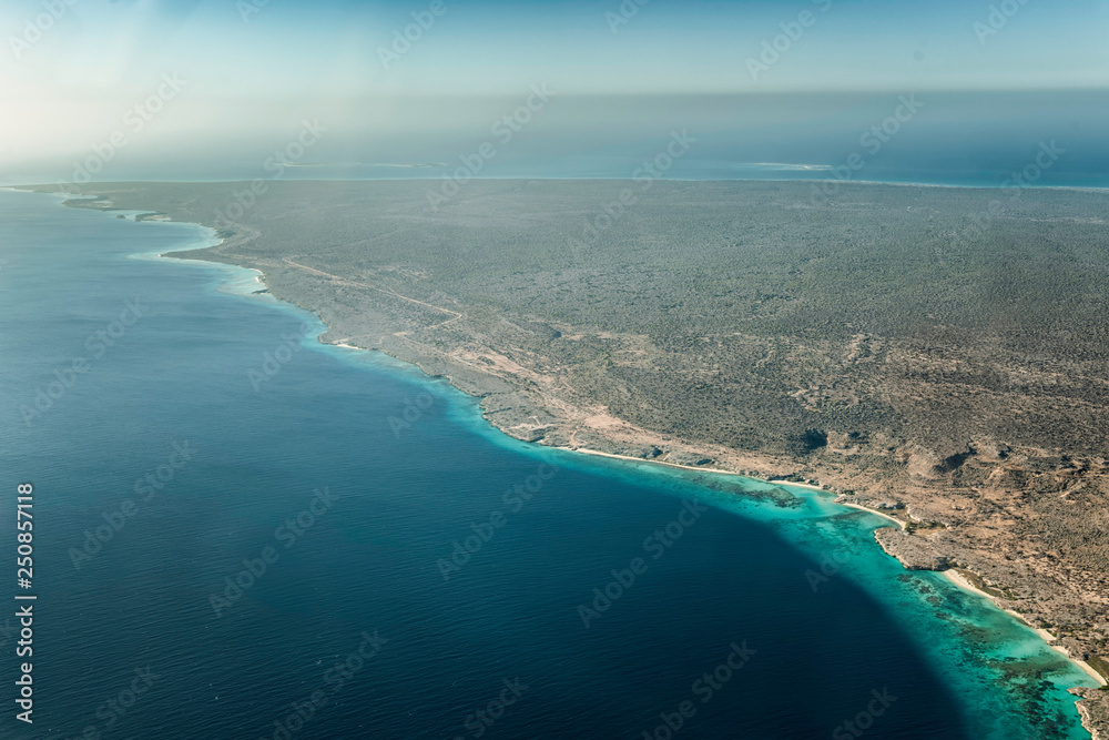 La Tortuga Island Caribbean sea as seen from small airplane. Flying to ...