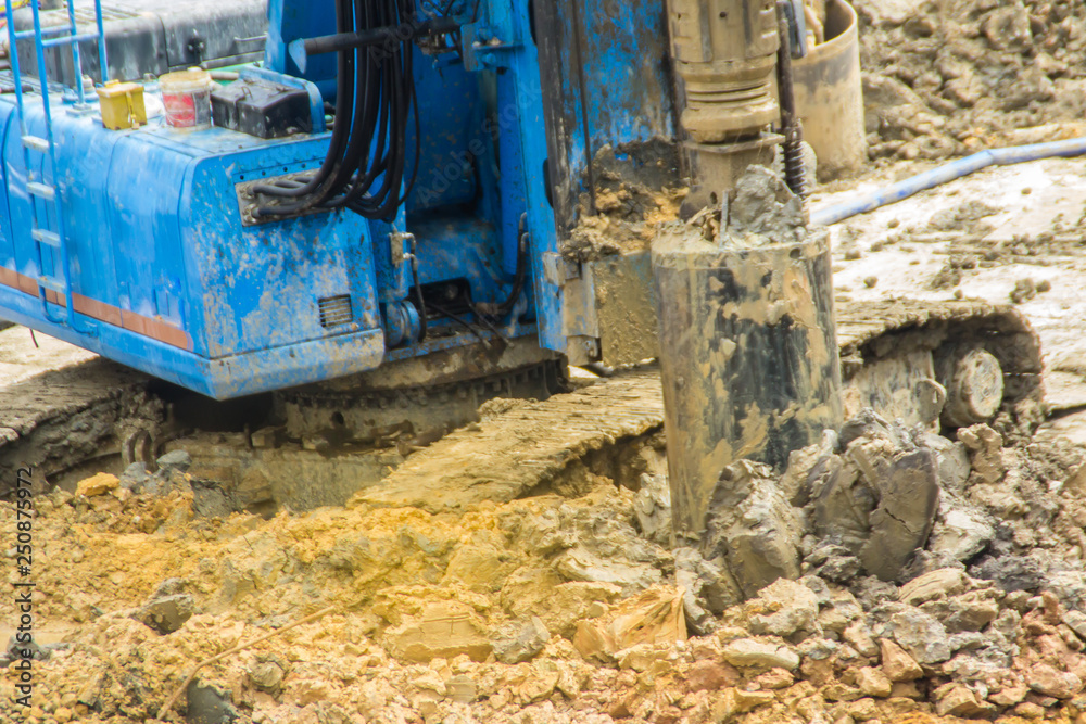 Hydraulic drilling machine is boring holes in the construction site for ...