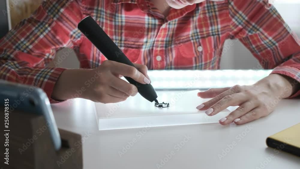 Female fashion designer drawing sketches for decoration. Woman draws in ...