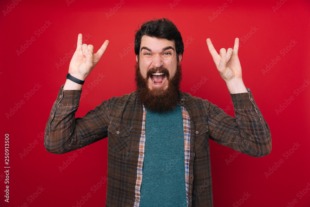 Guy rocking on party brings positive vibes. Carefree male with beard ...