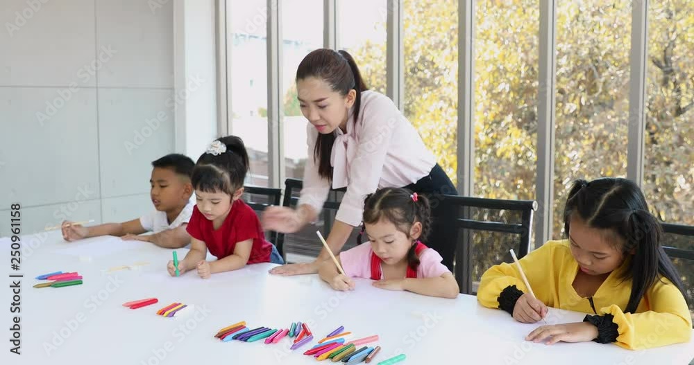 In art class, Asian students draw consciously, Asian teacher teaching ...