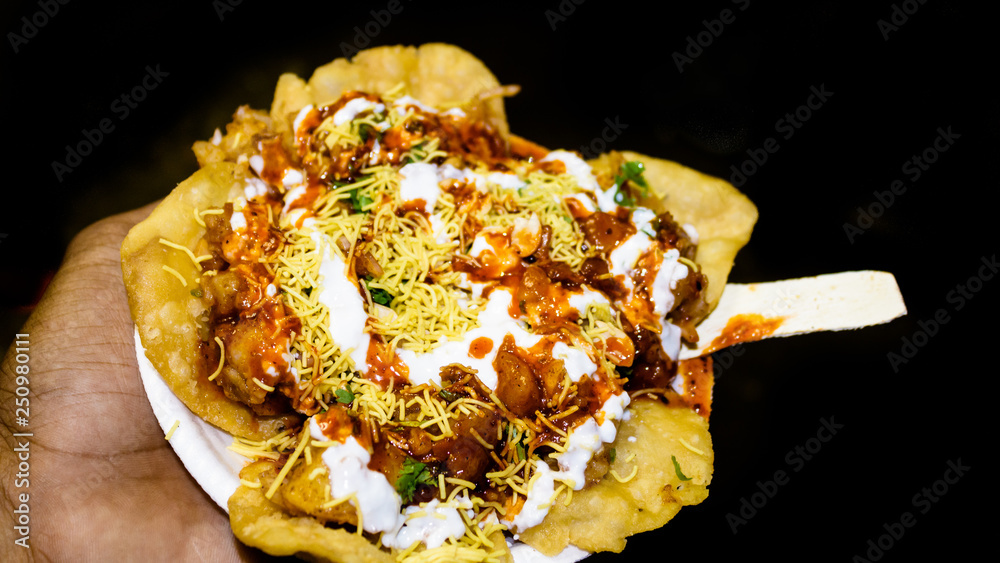 Indian famous Papdi Chaat (Papri Chaat). A yummy snack assorted with ...