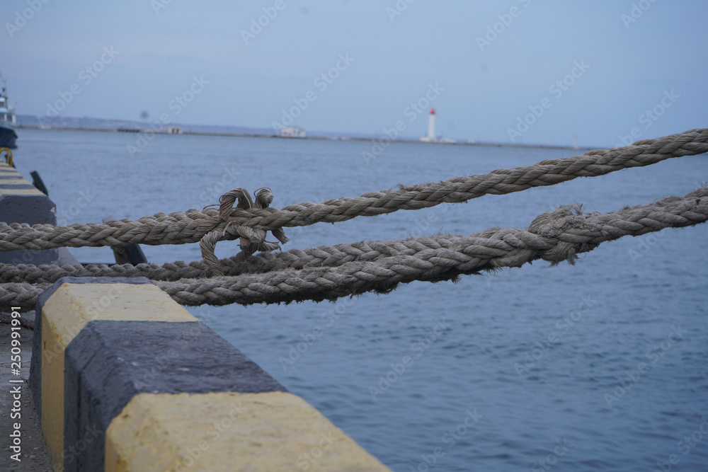 Lots of rope knots leading to moored ships. Boat ropes, ship. Mooring ...