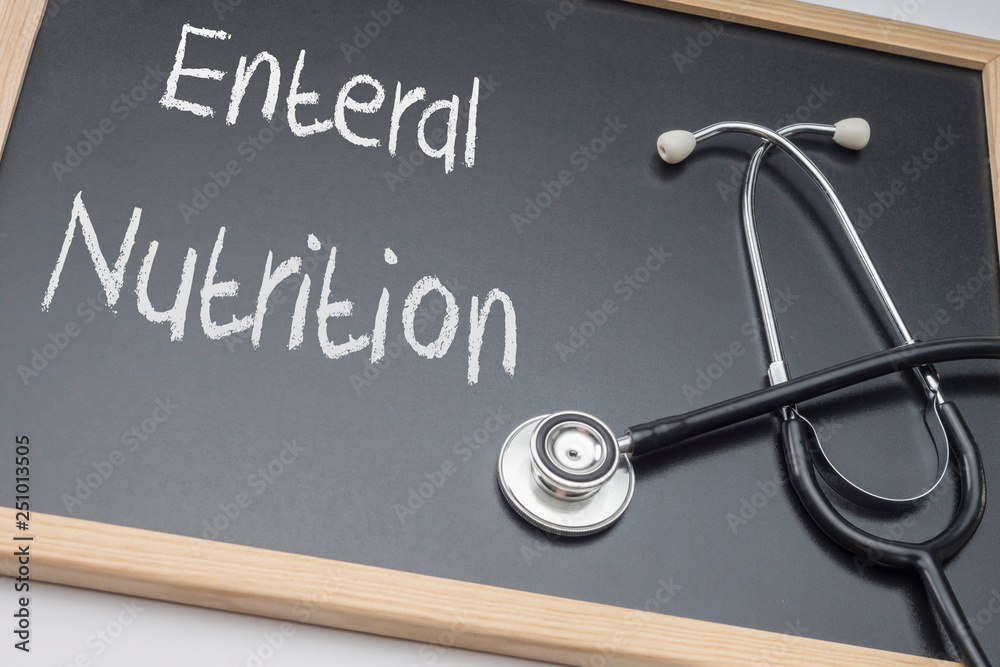 Enteral nutrition written on a blackboard, conceptual image, horizontal ...