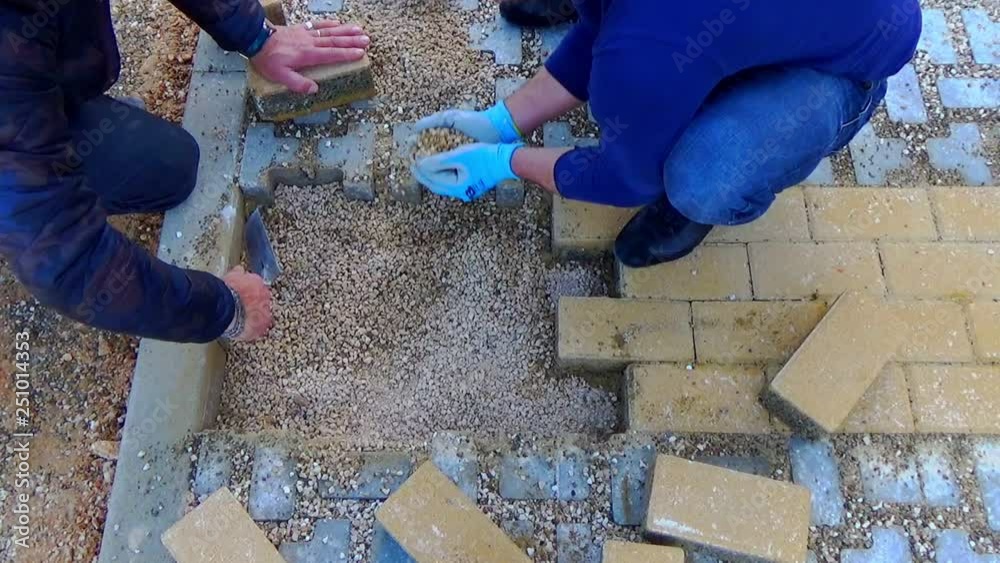 Repair work on a paving with self-locking blocks..After removing the ...
