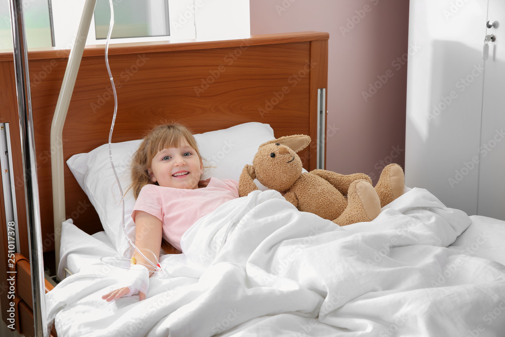 Little child with intravenous drip and toy in hospital bed Stock Photo ...