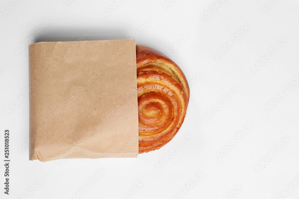 Paper bag with bun on white background, top view. Space for design ...