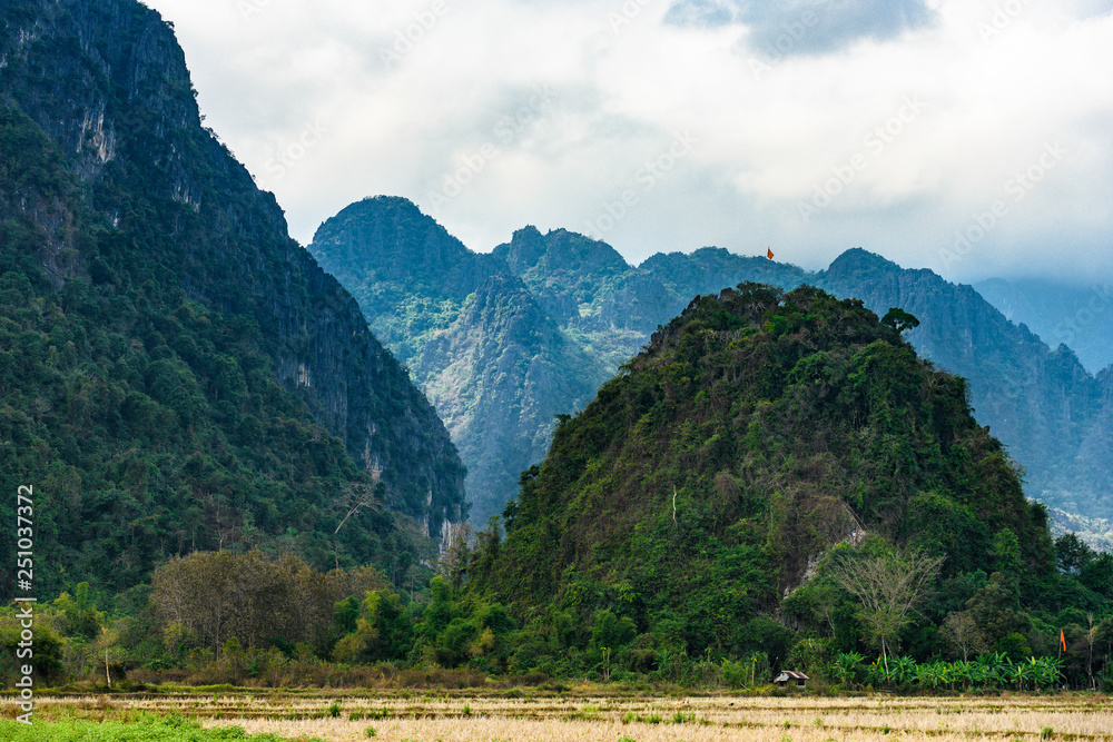 Foto de Stunning view of a some limestone mountains illuminated by some ...